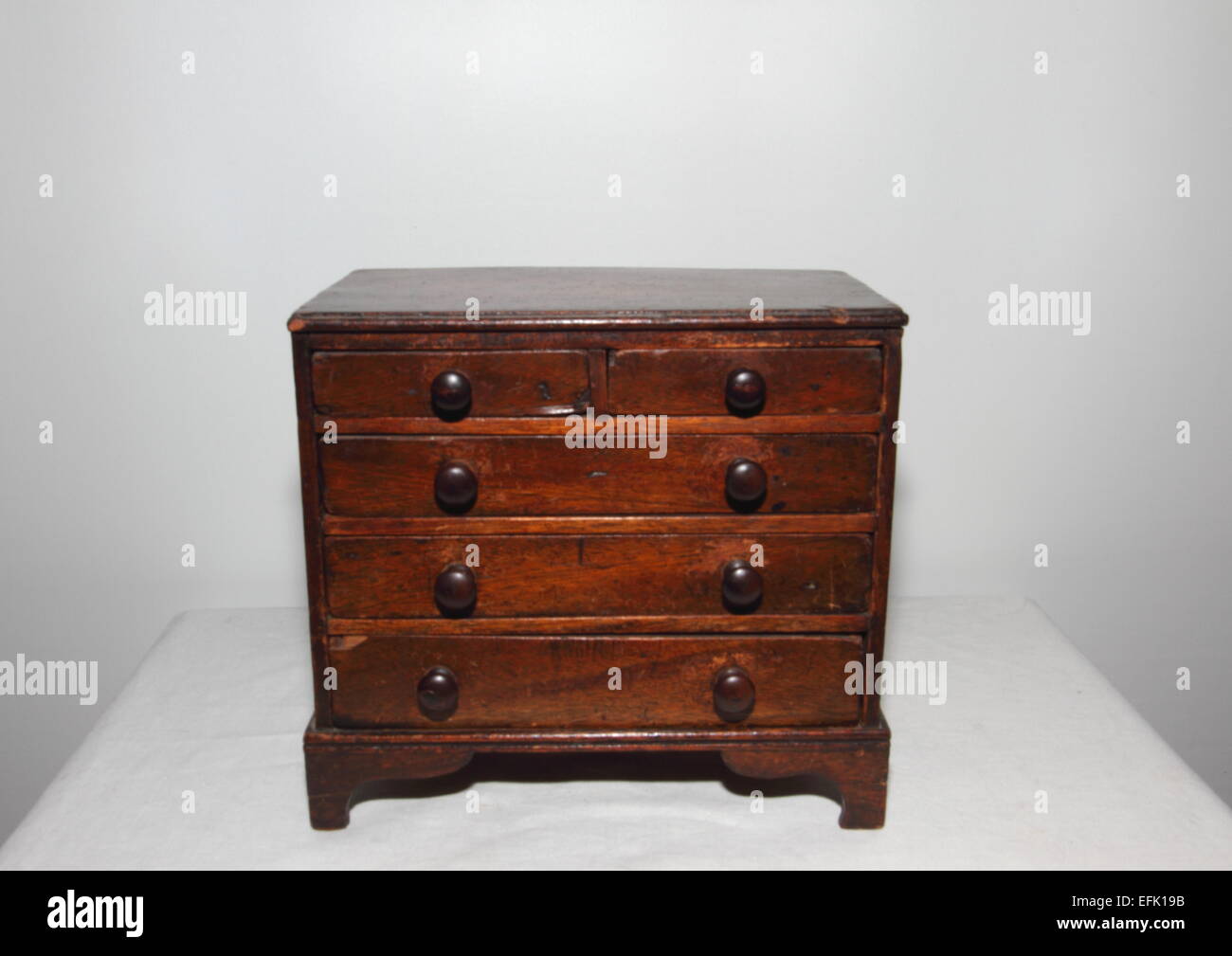 Miniature wooden chest of drawers Stock Photo - Alamy
