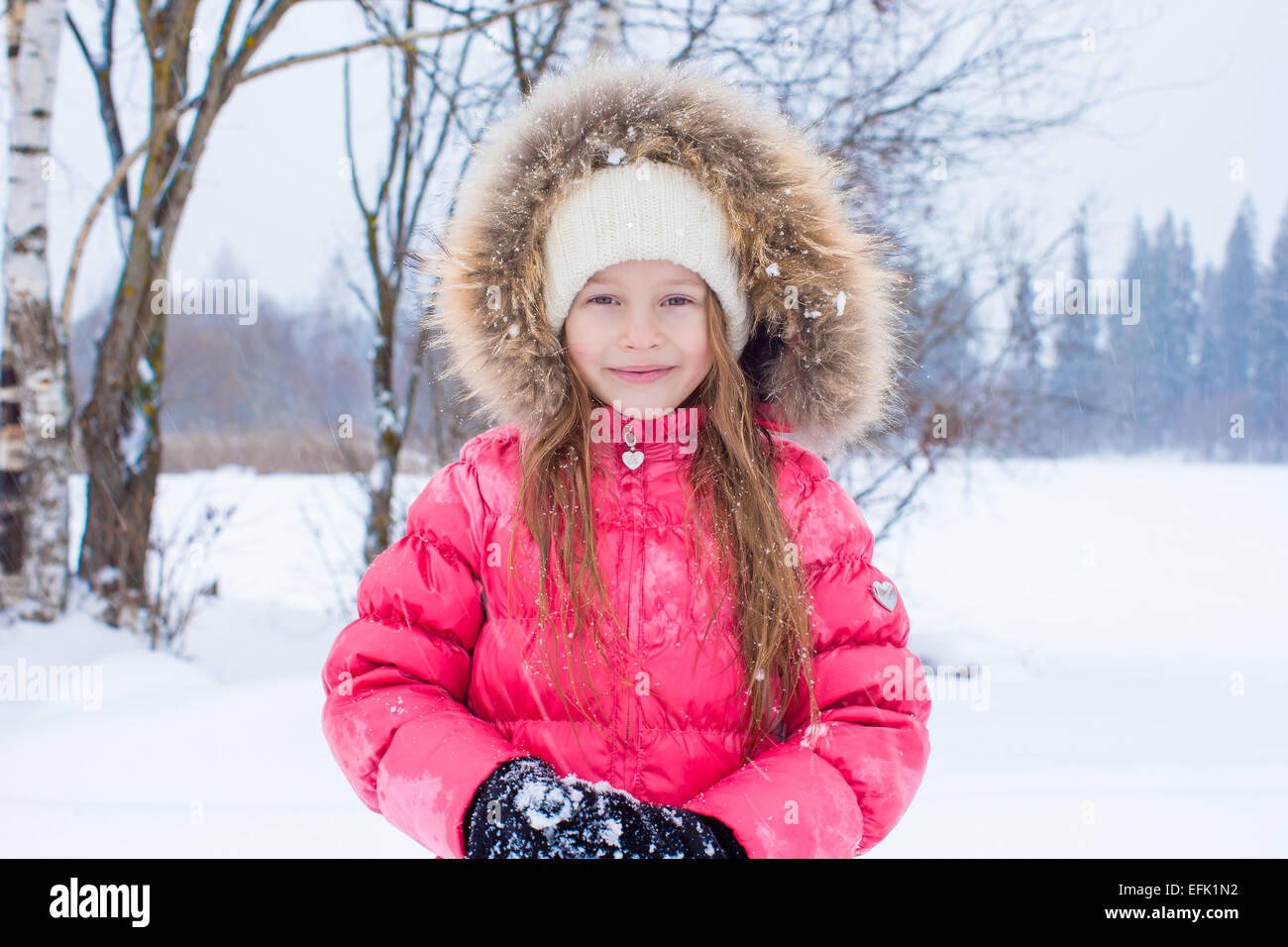 Adorable little girl outdoors on winter snow day Stock Photo - Alamy