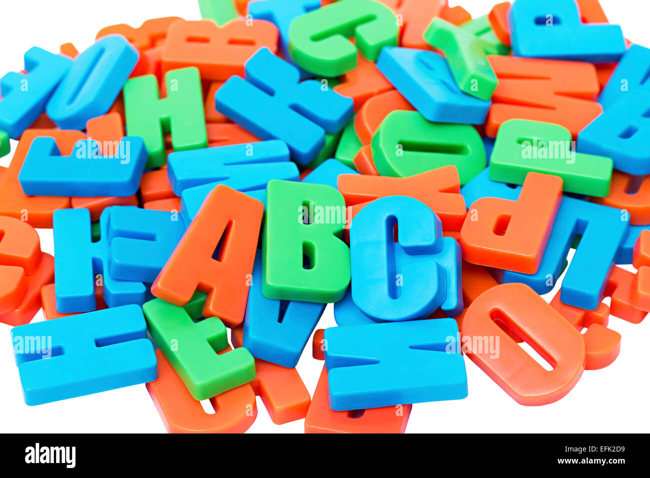 Colorful alphabet letters on a magnet isolated on white background ...