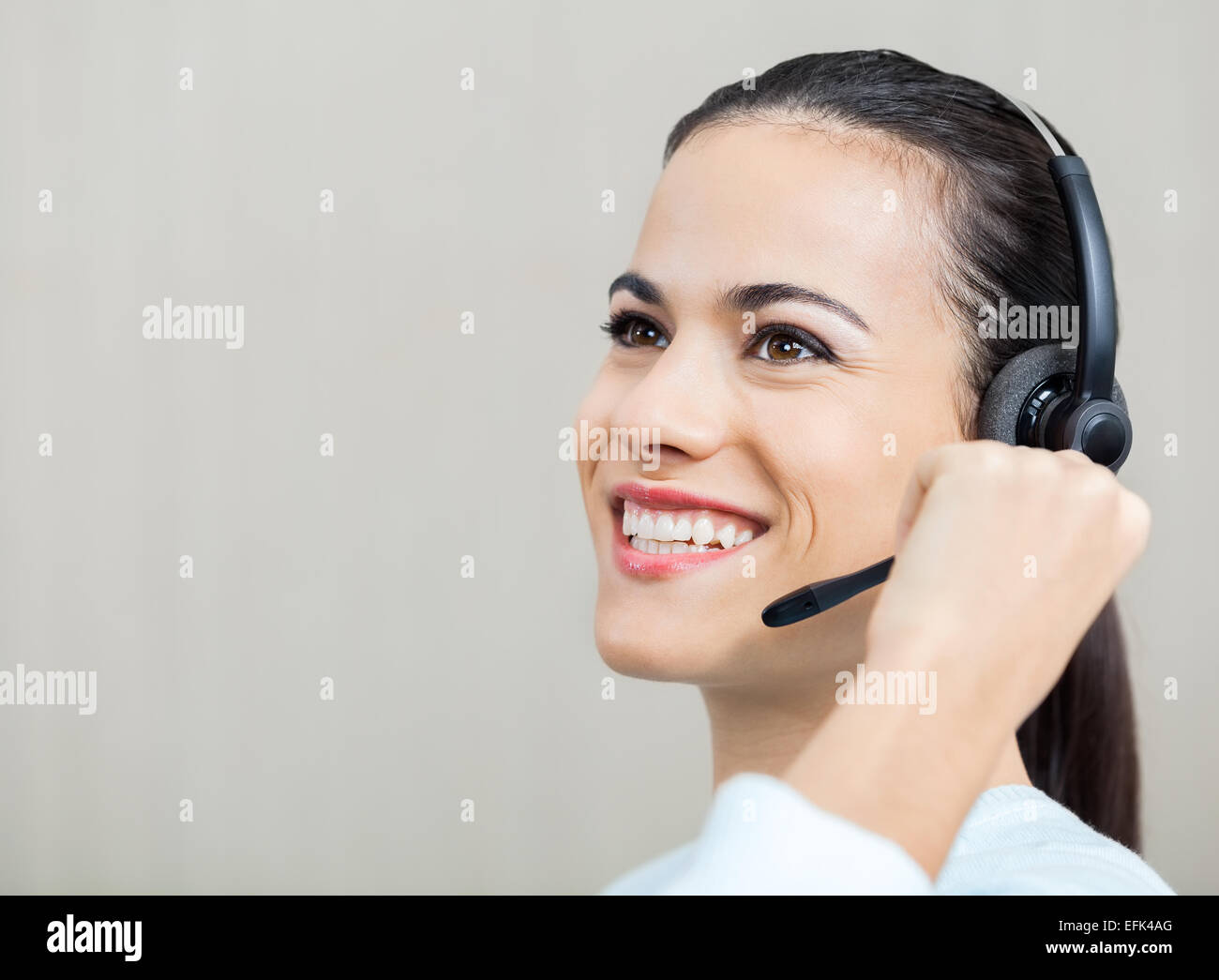 Customer Service Representative Talking On Headphones Stock Photo - Alamy