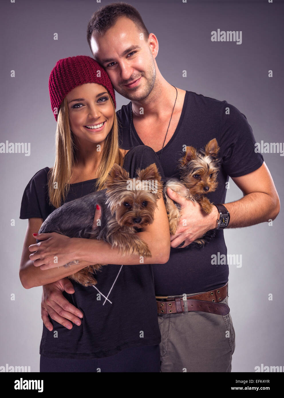Loving couple with two yorkshire terrier dogs Stock Photo - Alamy