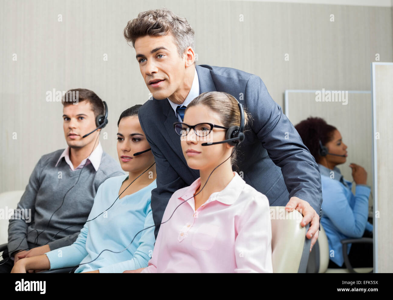 Manager Explaining To Employee In Call Center Stock Photo - Alamy