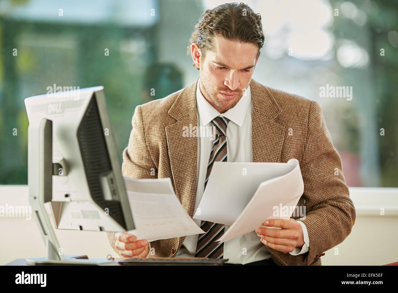 Man working in office Stock Photo - Alamy