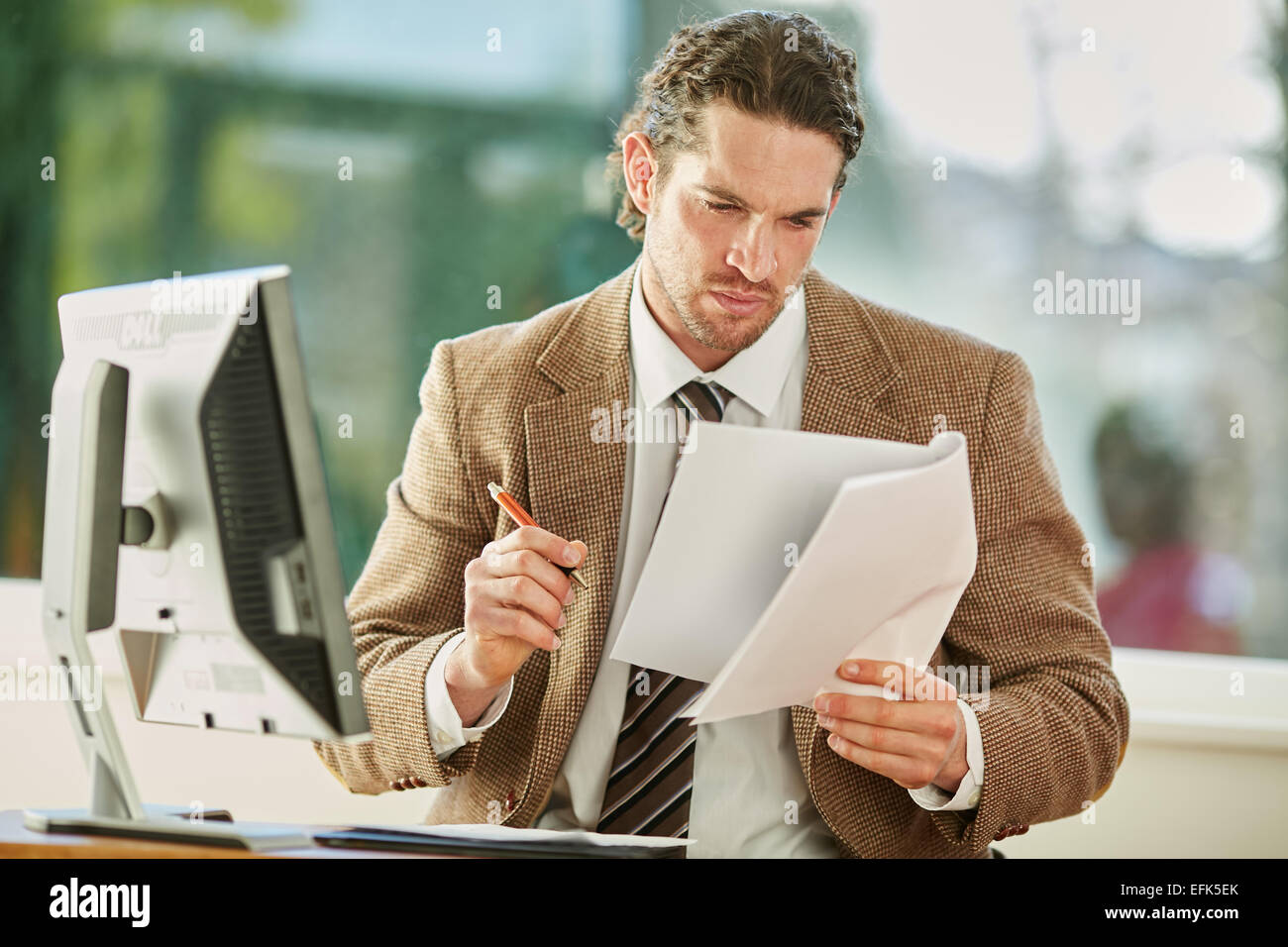 Man working in office Stock Photo - Alamy