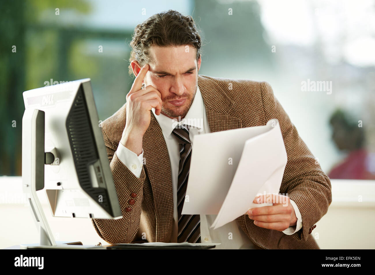 Man working in office Stock Photo - Alamy