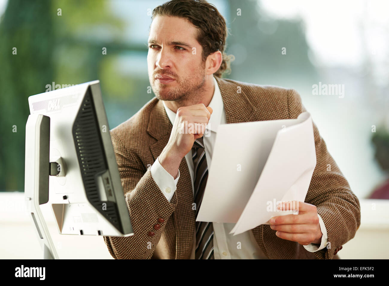 Man working in office Stock Photo - Alamy