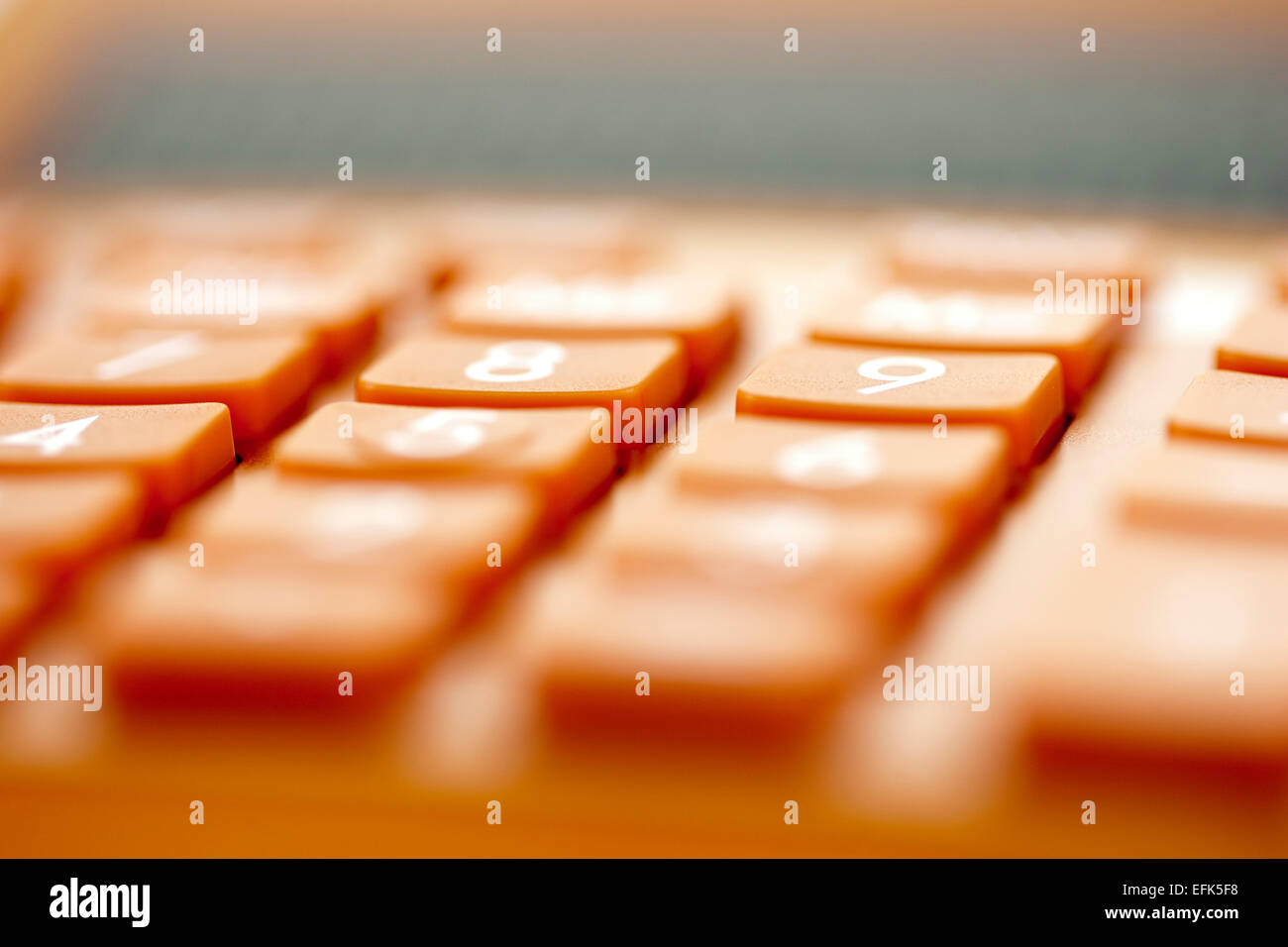 Very narrow depth of field through a shallow angle of the buttons on an ...