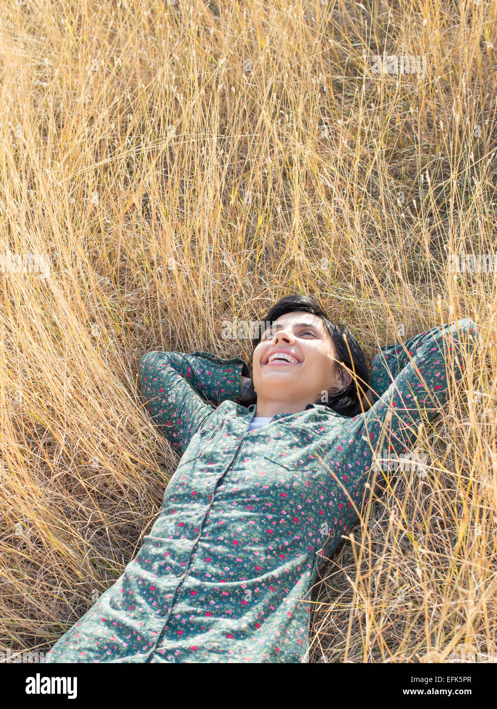 beautiful Young woman lying on hay Stock Photo - Alamy