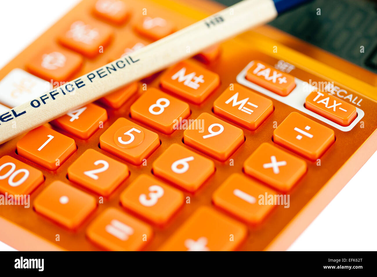 Orange Calculator with a pencil resting across the buttons Stock Photo ...