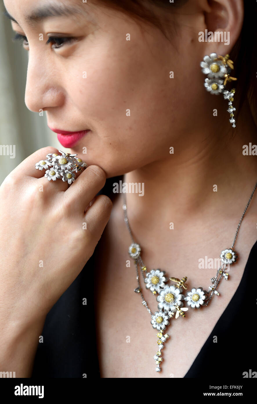 Beijing, China. 6th Feb, 2015. A model shows a set of jewellery during ...