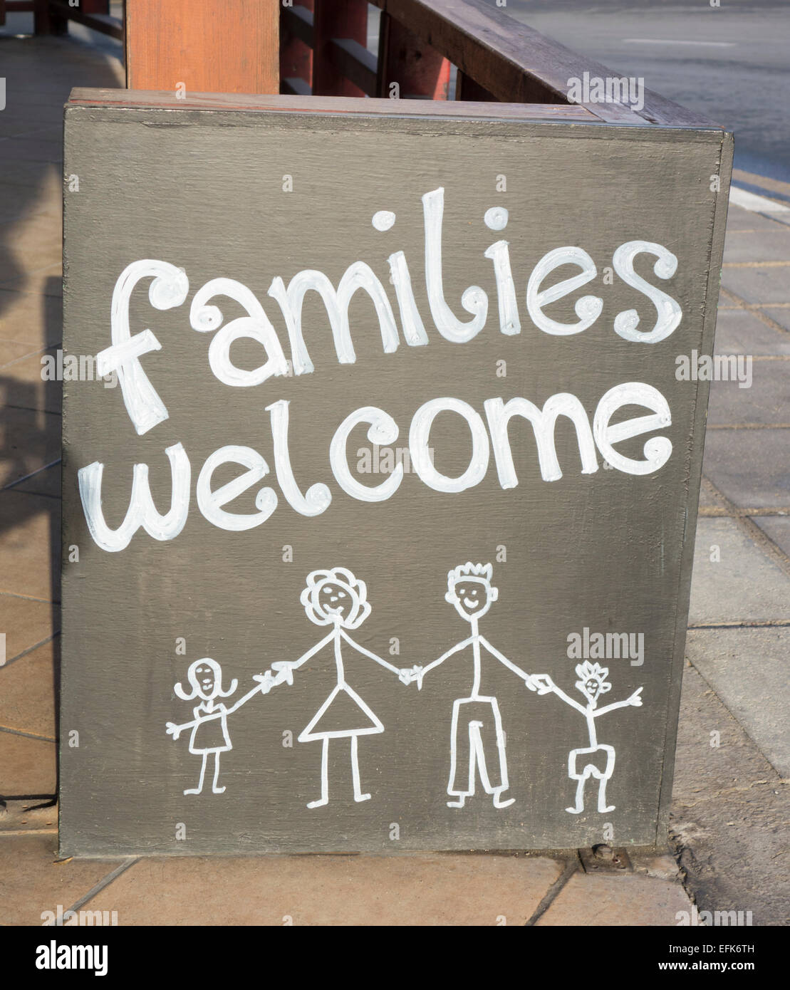 «Families welcome» sign in the street Stock Photo - Alamy