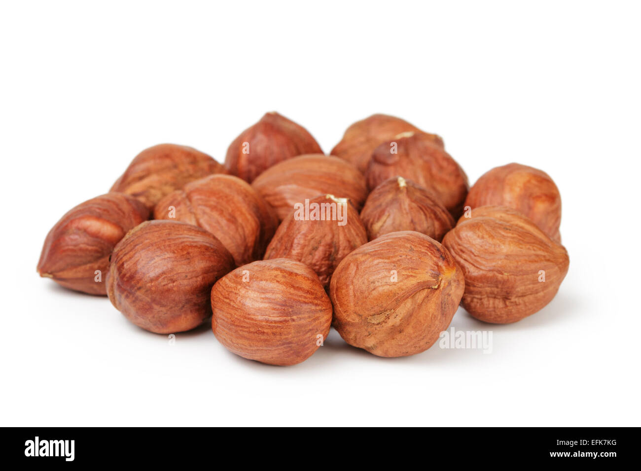 Heap of peeled hazelnuts isolated on white Stock Photo - Alamy