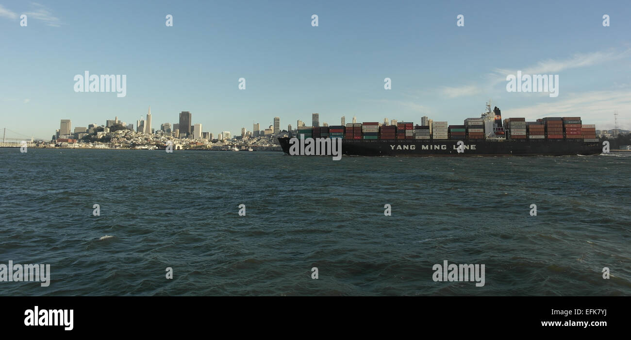 Blue sky view, from bay ferry, Yang Ming Line 'Orchid' container ship ...