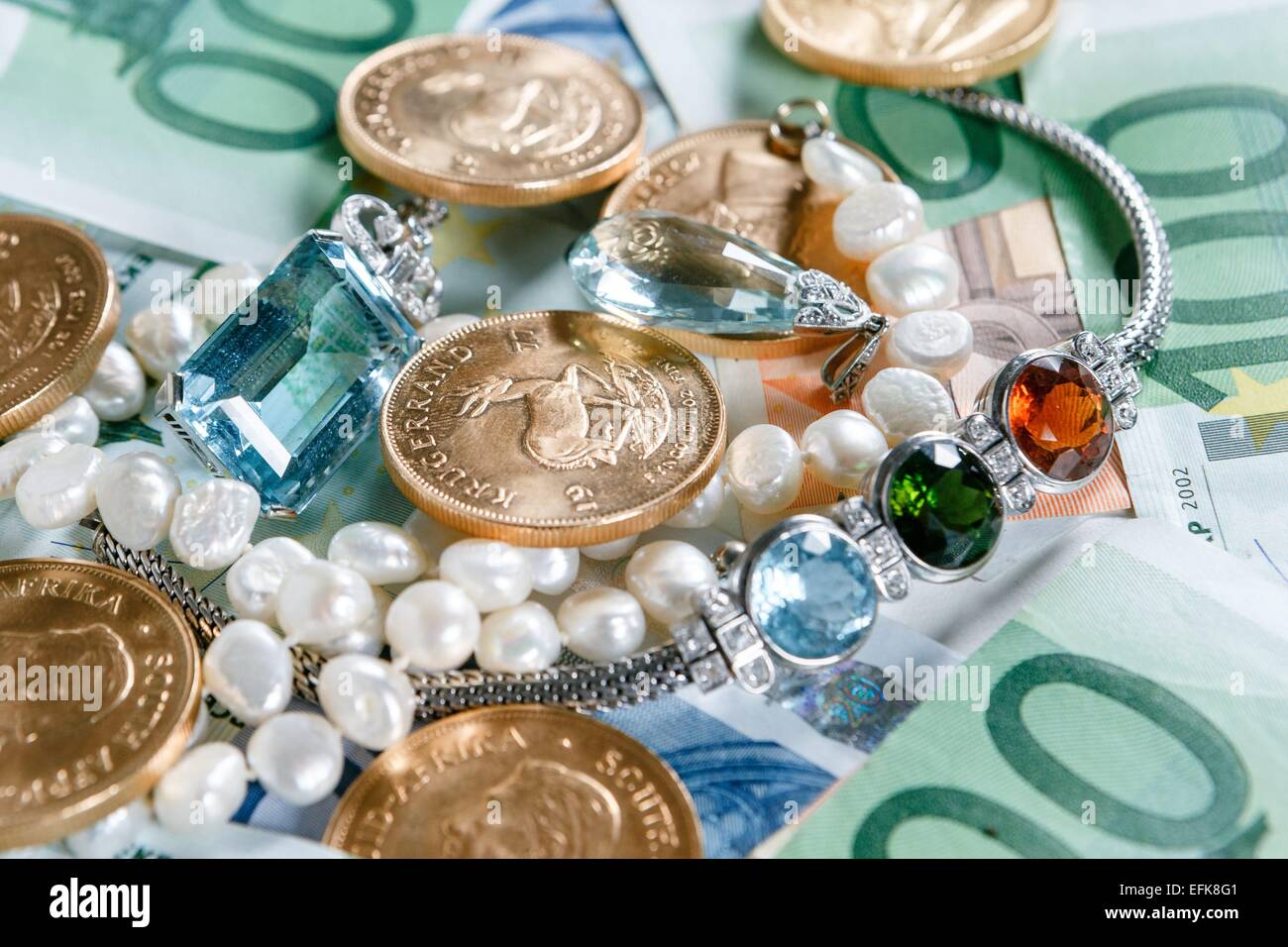 Gold, money and jewelry Stock Photo - Alamy