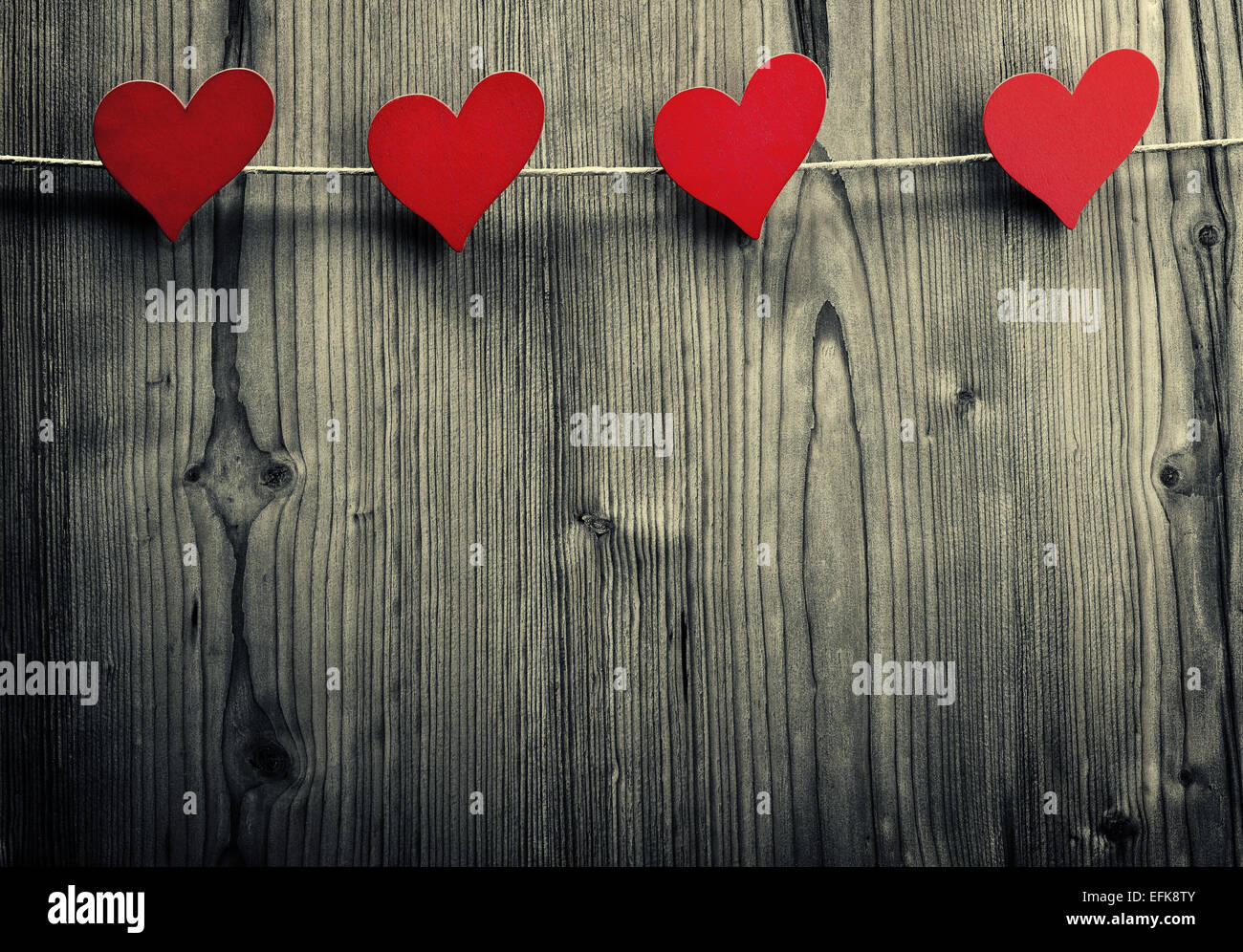 Heart-shaped clips are hanging on the rope, Valentine's Day, love ...