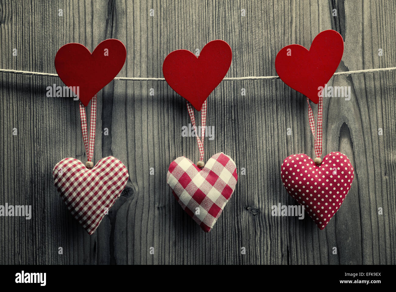 Textile hearts hanging on the rope - Valentine's Day background Stock ...
