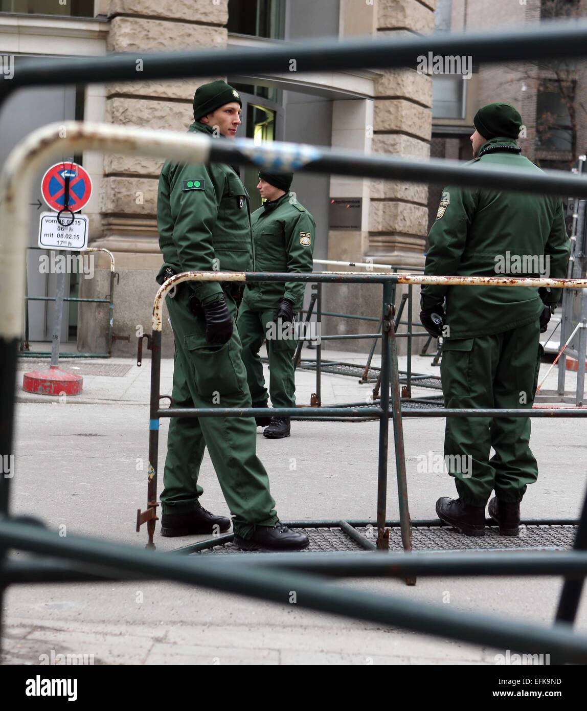 Munich. 6th Feb, 2015. Security officers stand guard outside the ...