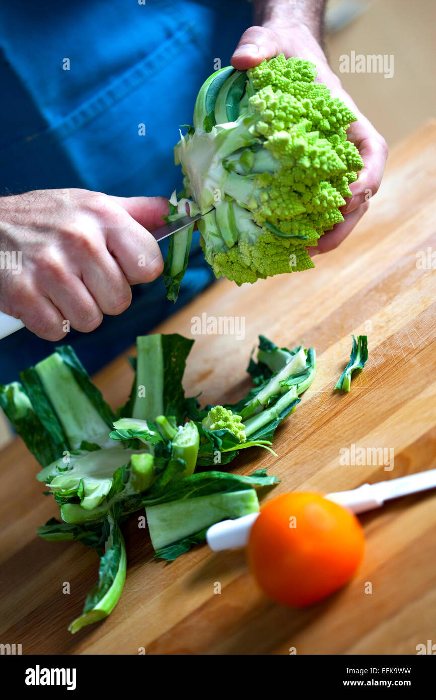 Chef cutting vegetables in a kitchen Stock Photo - Alamy