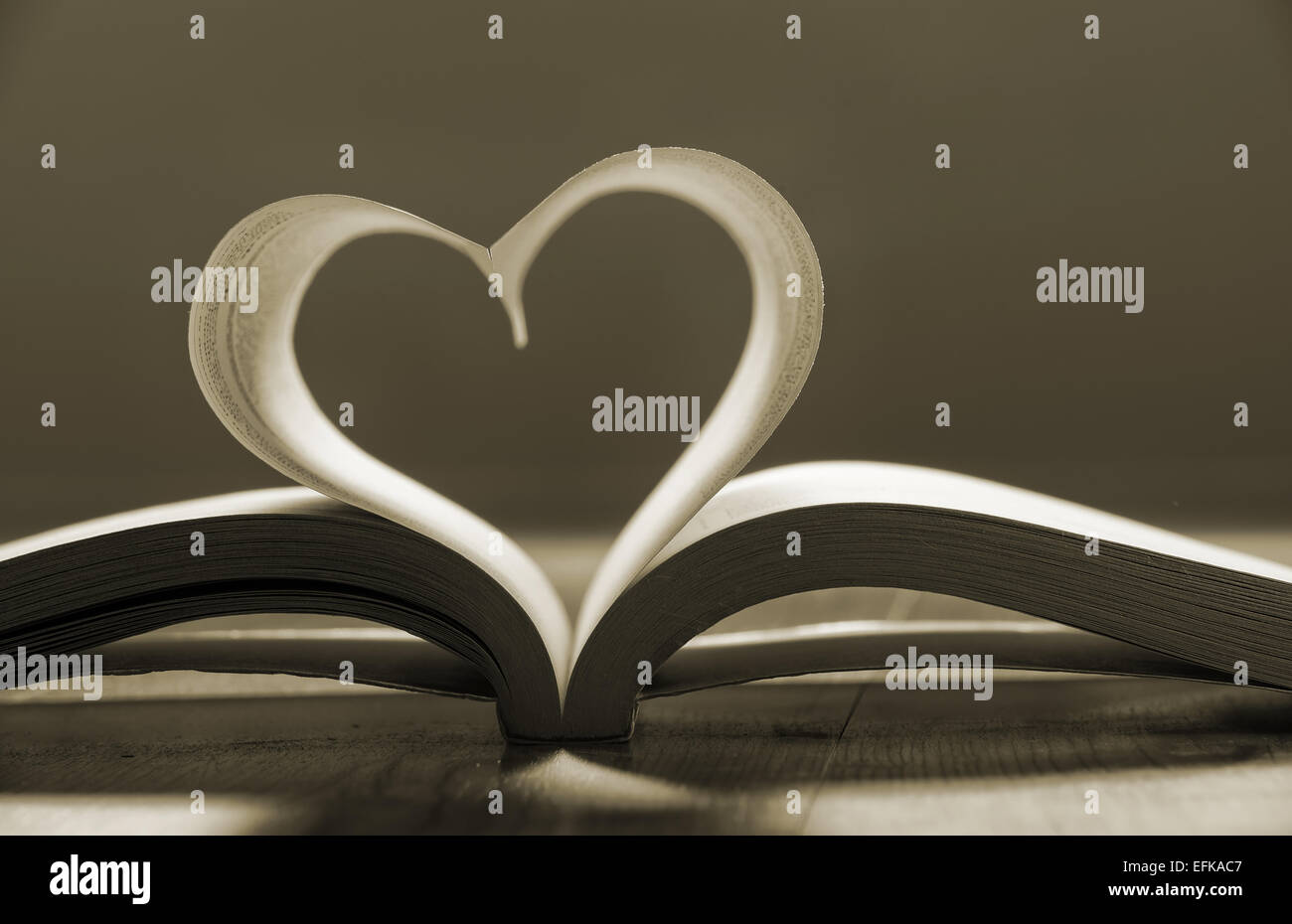 Open book with pages forming heart shape Stock Photo - Alamy