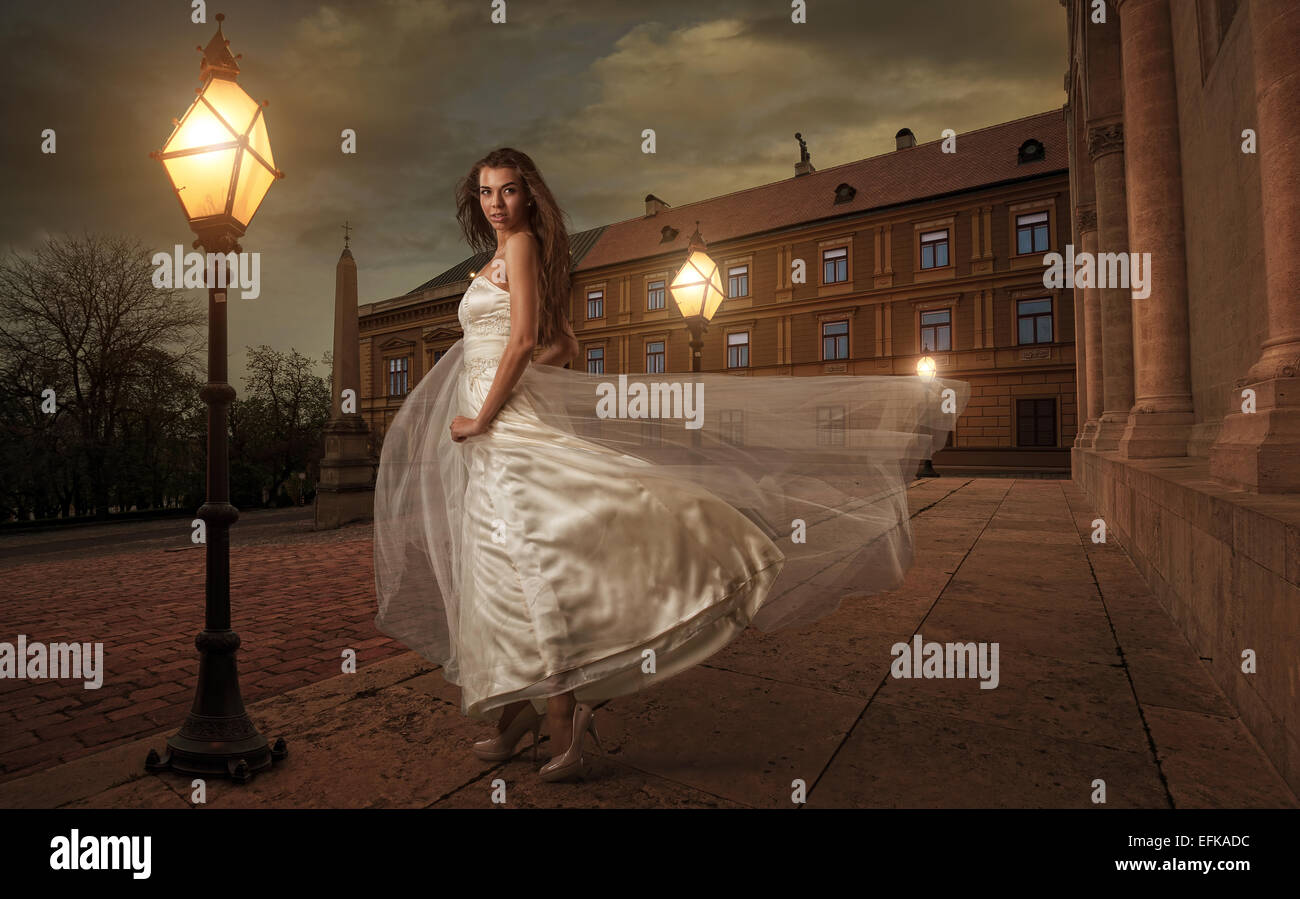 Bride in the night before the church Stock Photo - Alamy