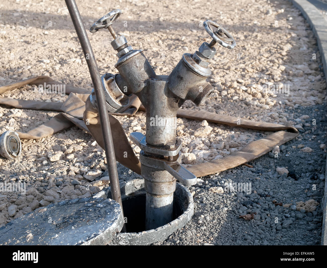 open hatch of hydrant on construction site Stock Photo - Alamy
