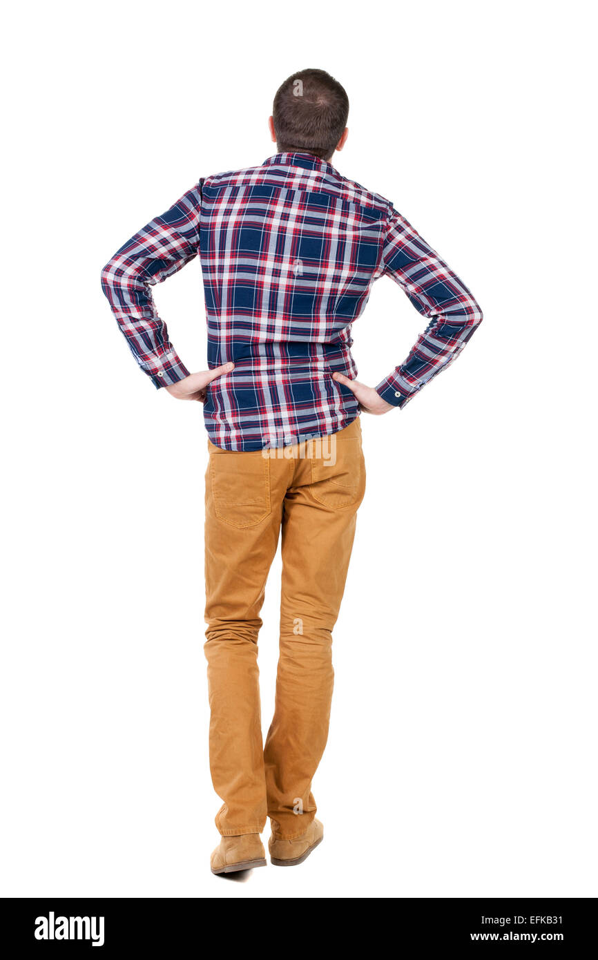 Back view of handsome man in shirt. Standing young guy in jeans. Rear ...