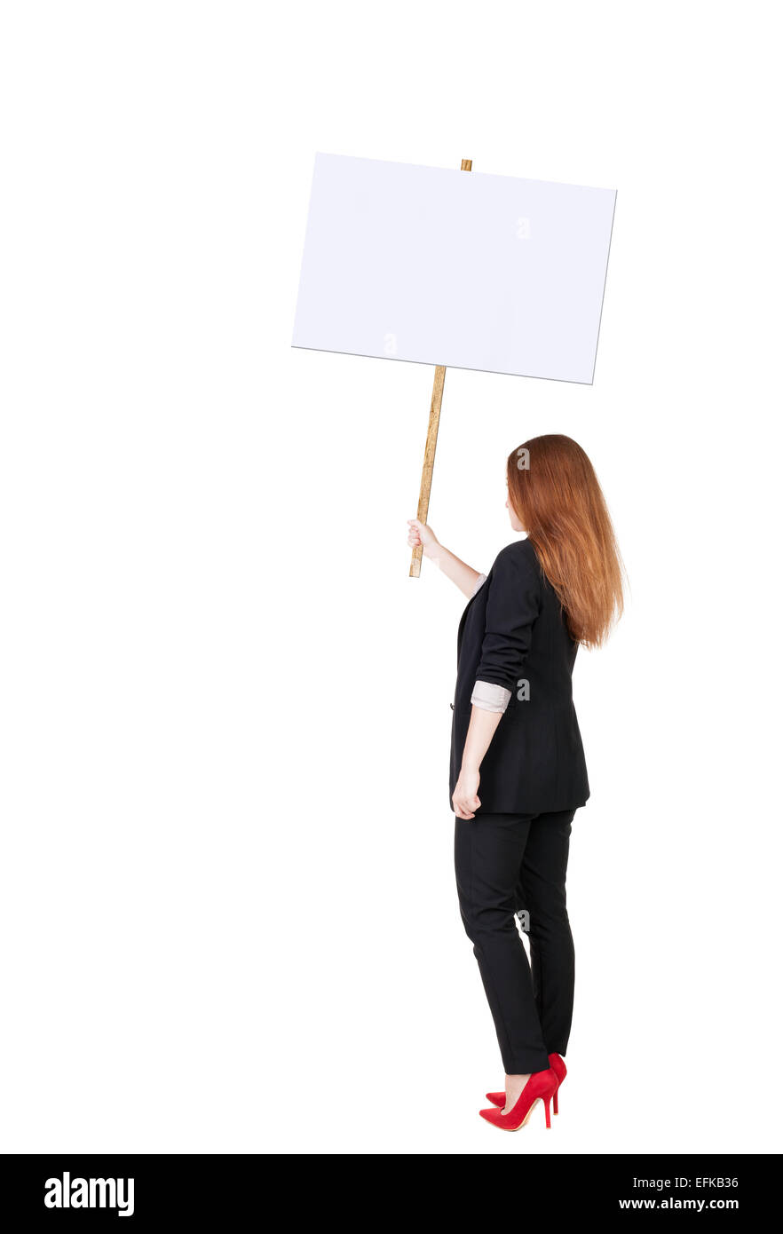 Back view business woman showing sign board. young redhead girl holds ...