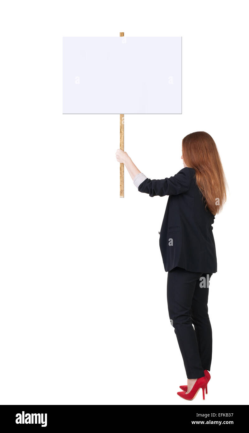 Back view business woman showing sign board. young redhead girl holds ...