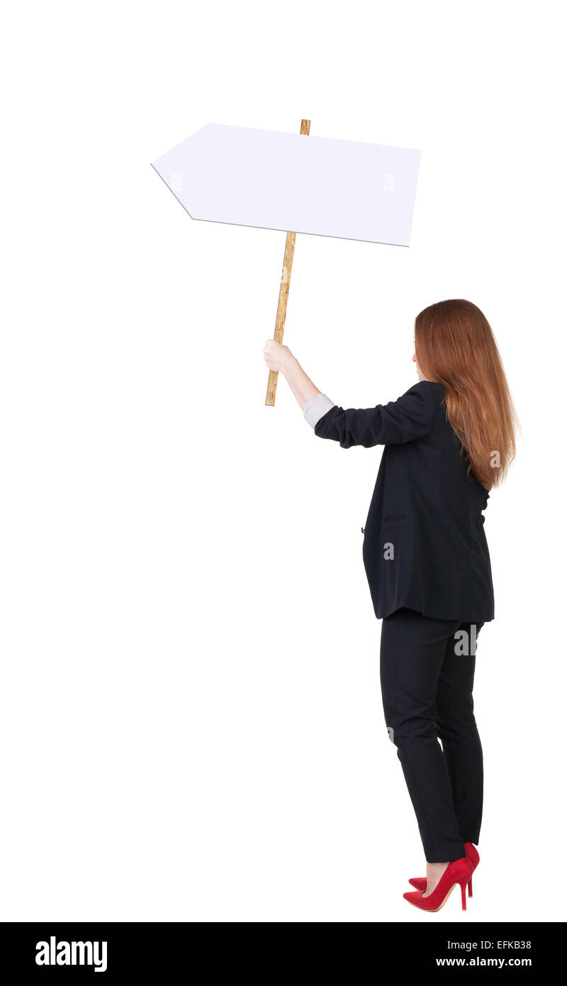 Back view business woman showing sign board. young redhead girl holds ...