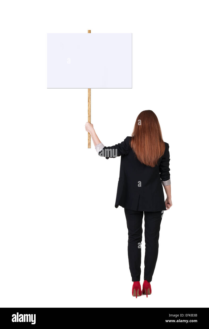 Back view business woman showing sign board. young redhead girl holds ...