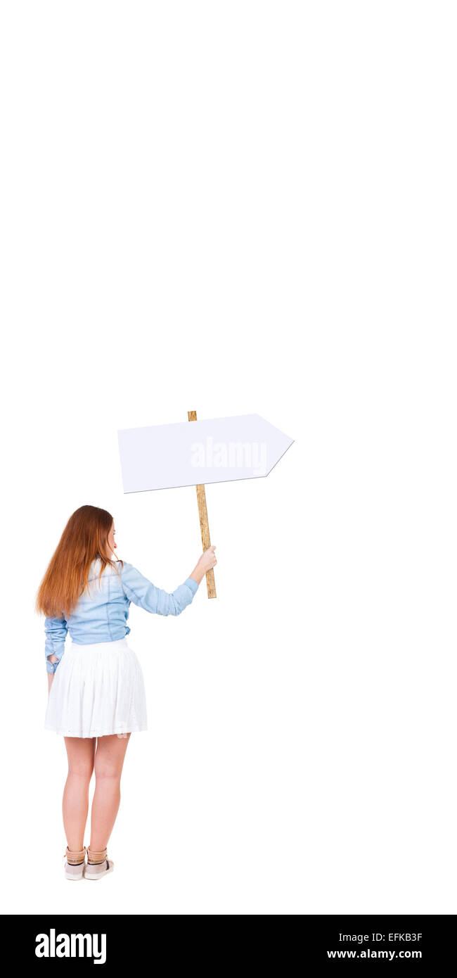 Back view of woman showing a sign board. young redhead girl holds ...