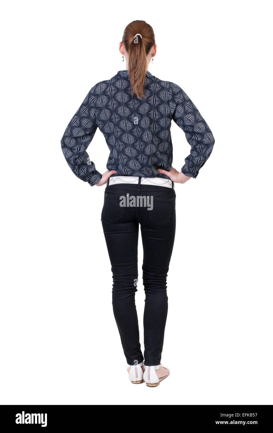 back view of standing young beautiful blonde woman in jeans. girl ...