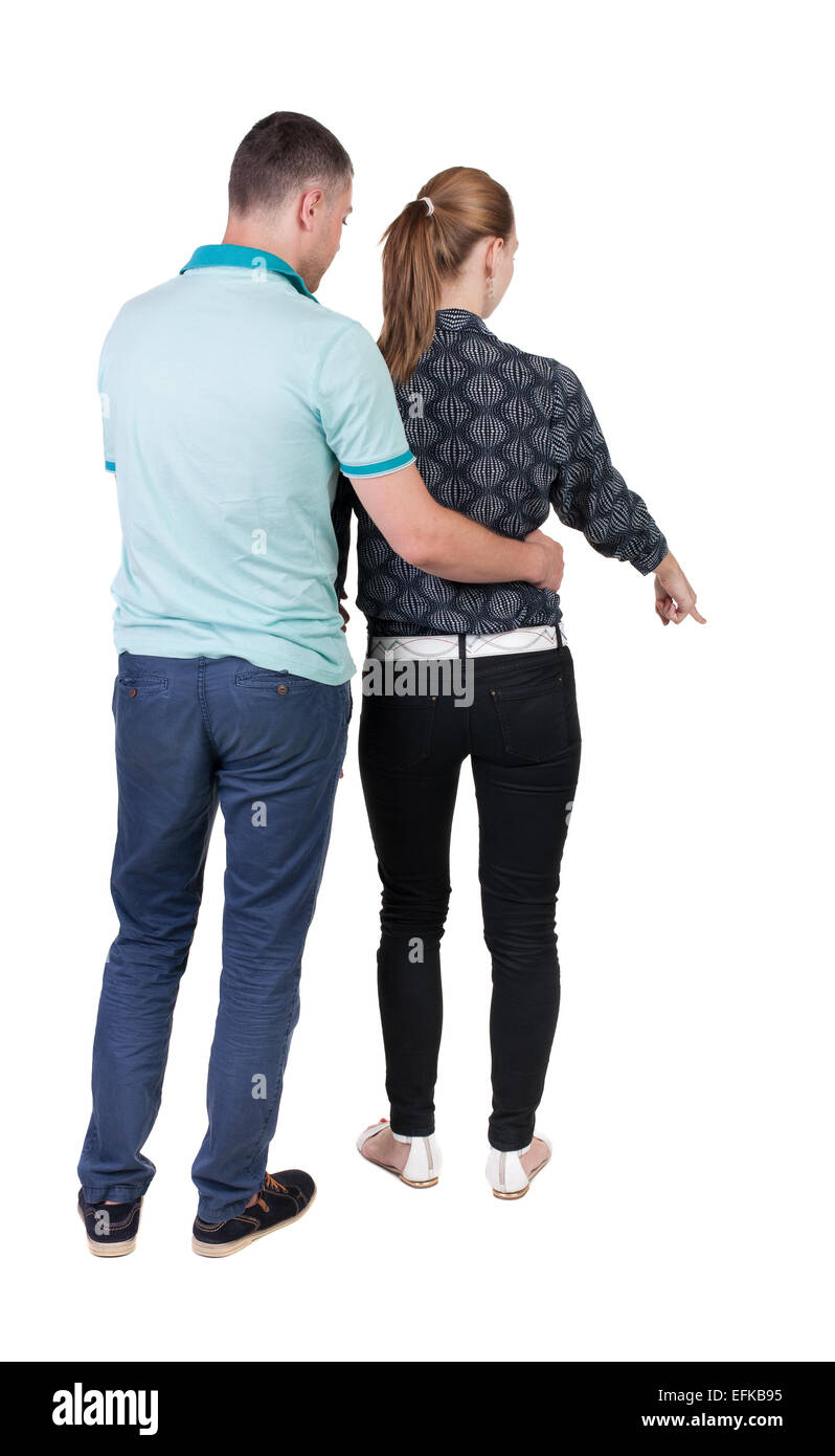 young couple pointing. Back view. Rear view people collection. backside ...