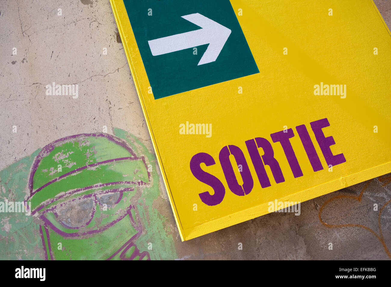 Exit sign and graffiti on a wall Stock Photo - Alamy
