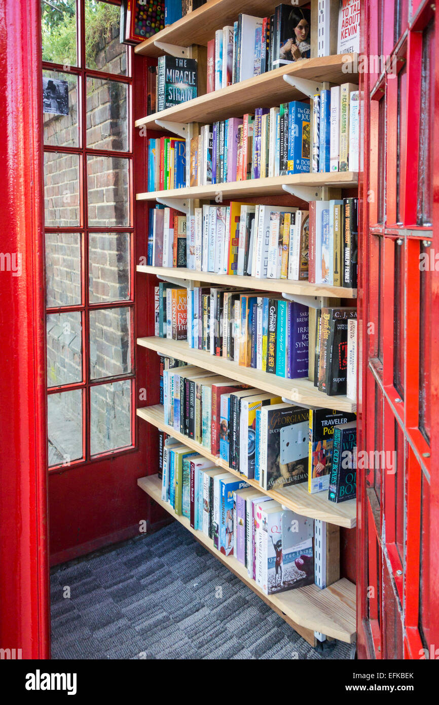 British red telephone box now used as a micro library Stock Photo - Alamy