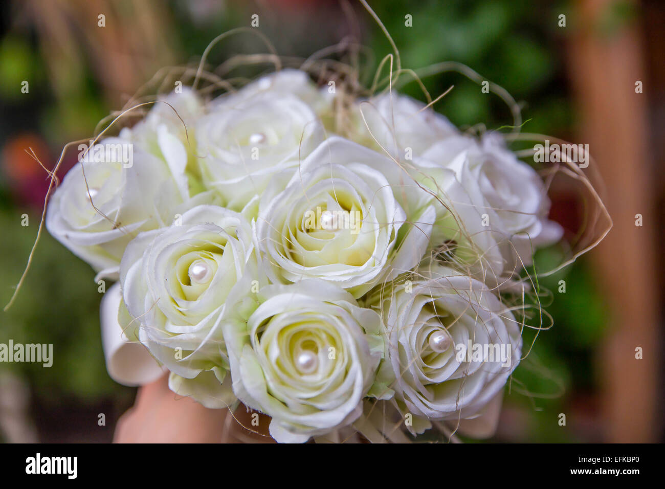 bouquet of artificial roses with white pearls Stock Photo - Alamy