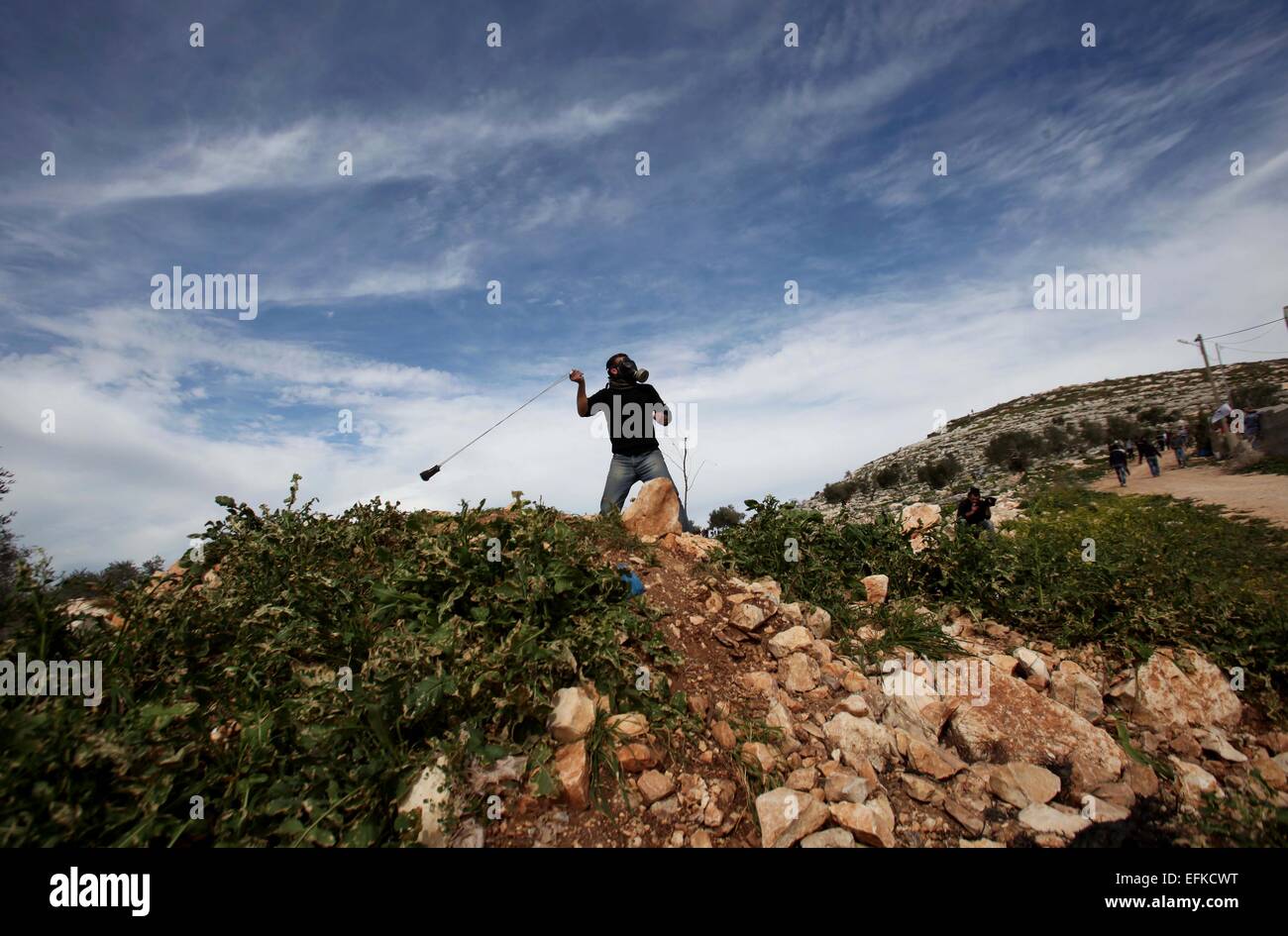 Palestinian youth uses sling stone hi-res stock photography and images ...
