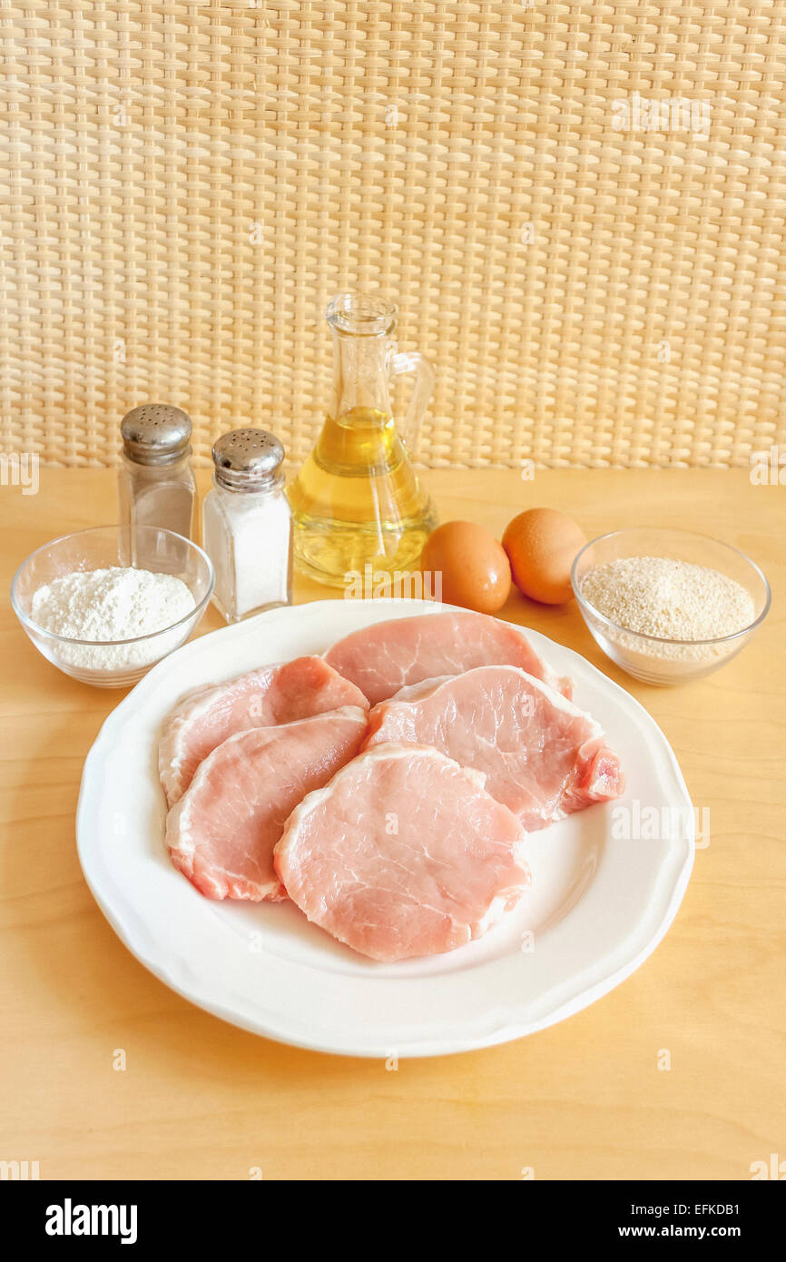 Preparing pork schnitzel - ingredients: pork loin chops, eggs, salt ...