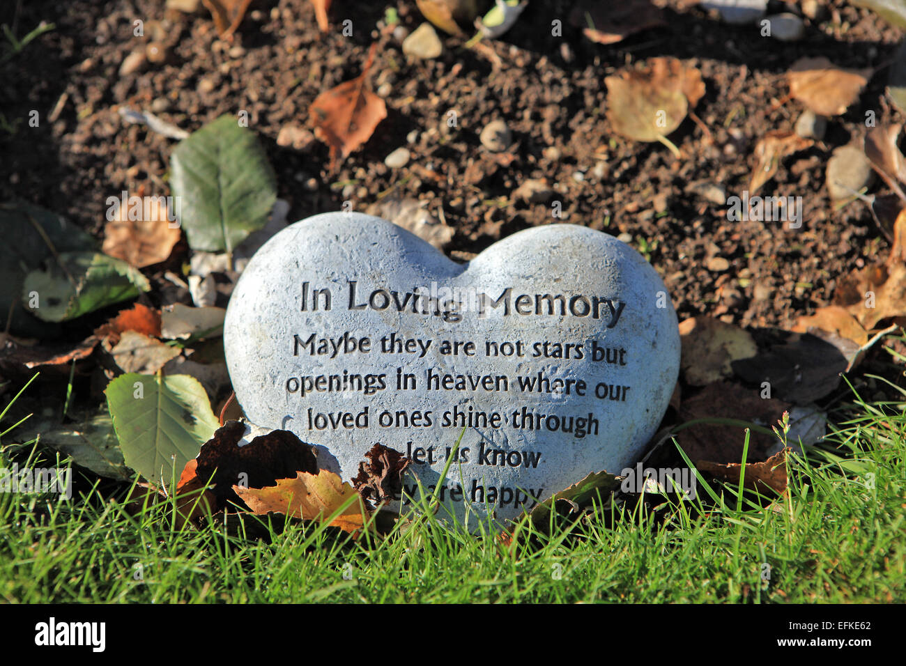 In Loving Memory heart shaped memorial stone Stock Photo - Alamy