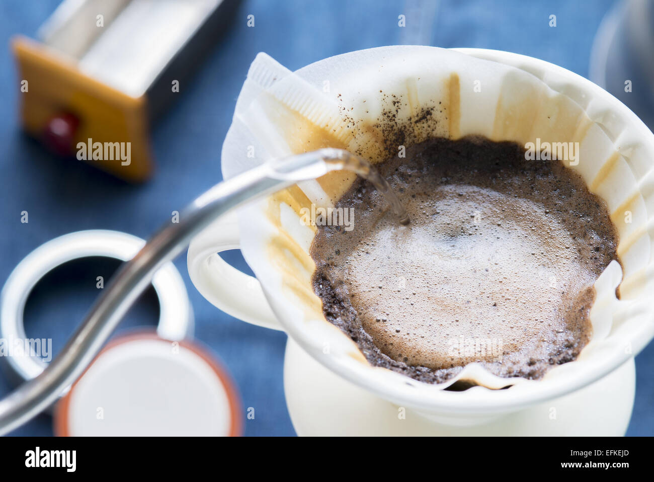 Making brewed coffee from steaming filter drip style Stock Photo - Alamy