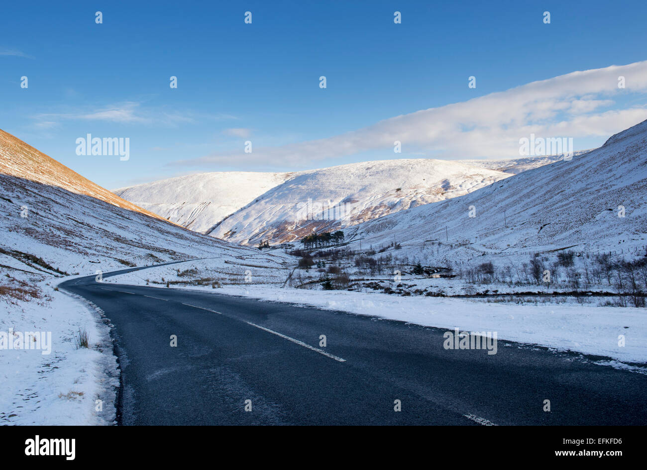Empty road through Yarrow valley mountains in winter. Scottish borders ...