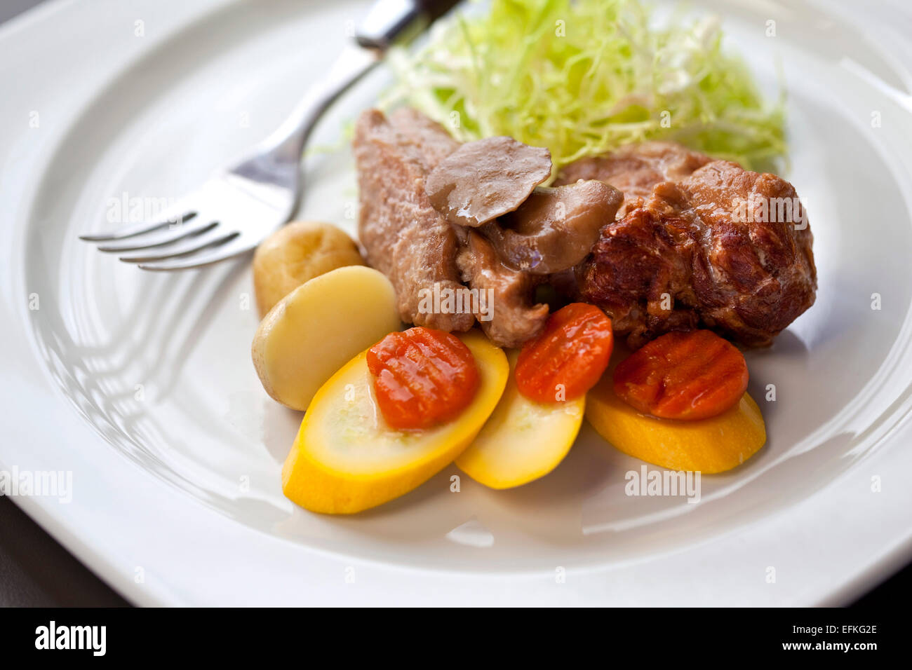 Veal, vegetable and green salad on a plate Stock Photo - Alamy