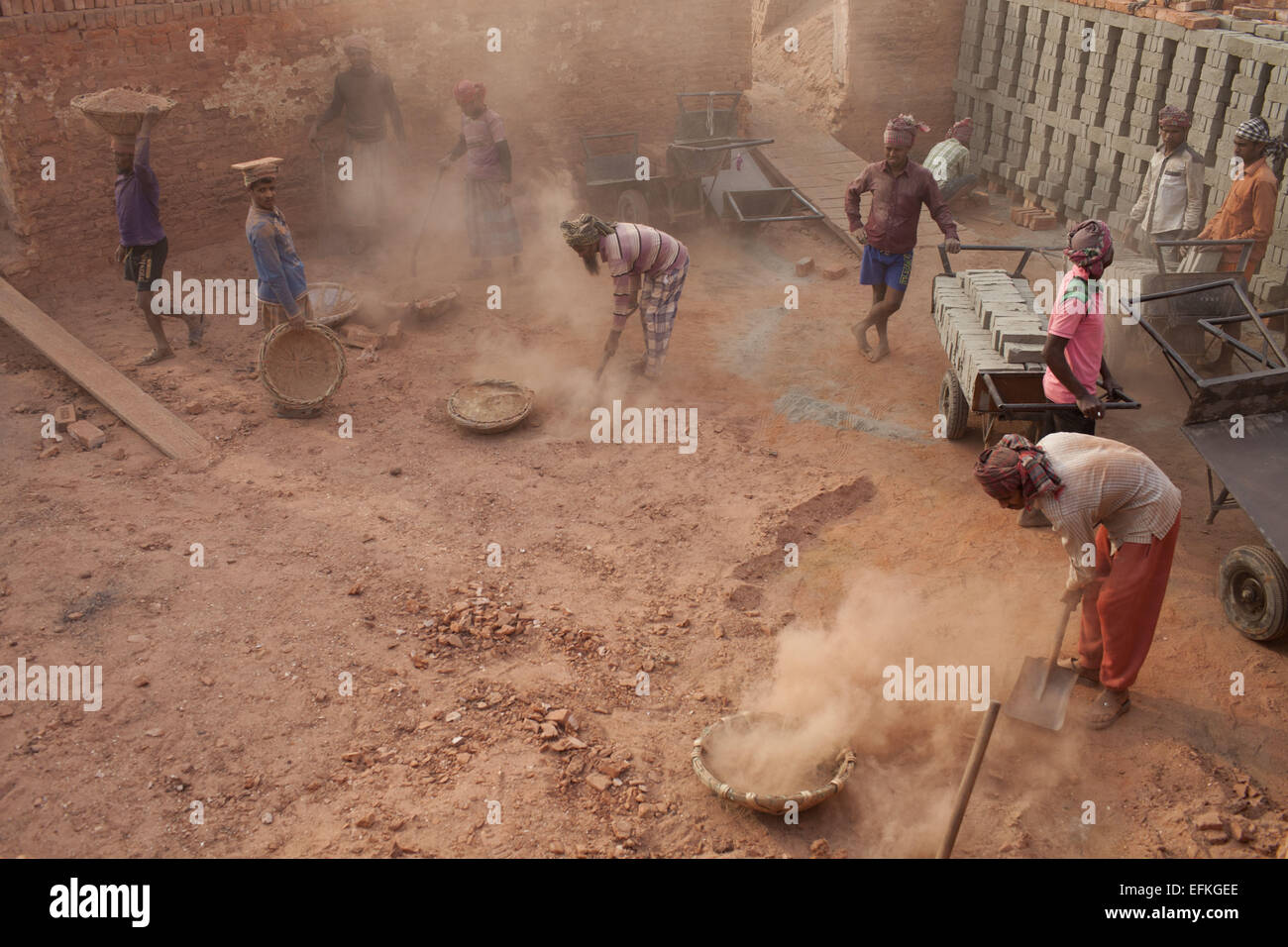 Bangladeshi day labourers work in a brick factory in Dhaka on 6 Feb ...