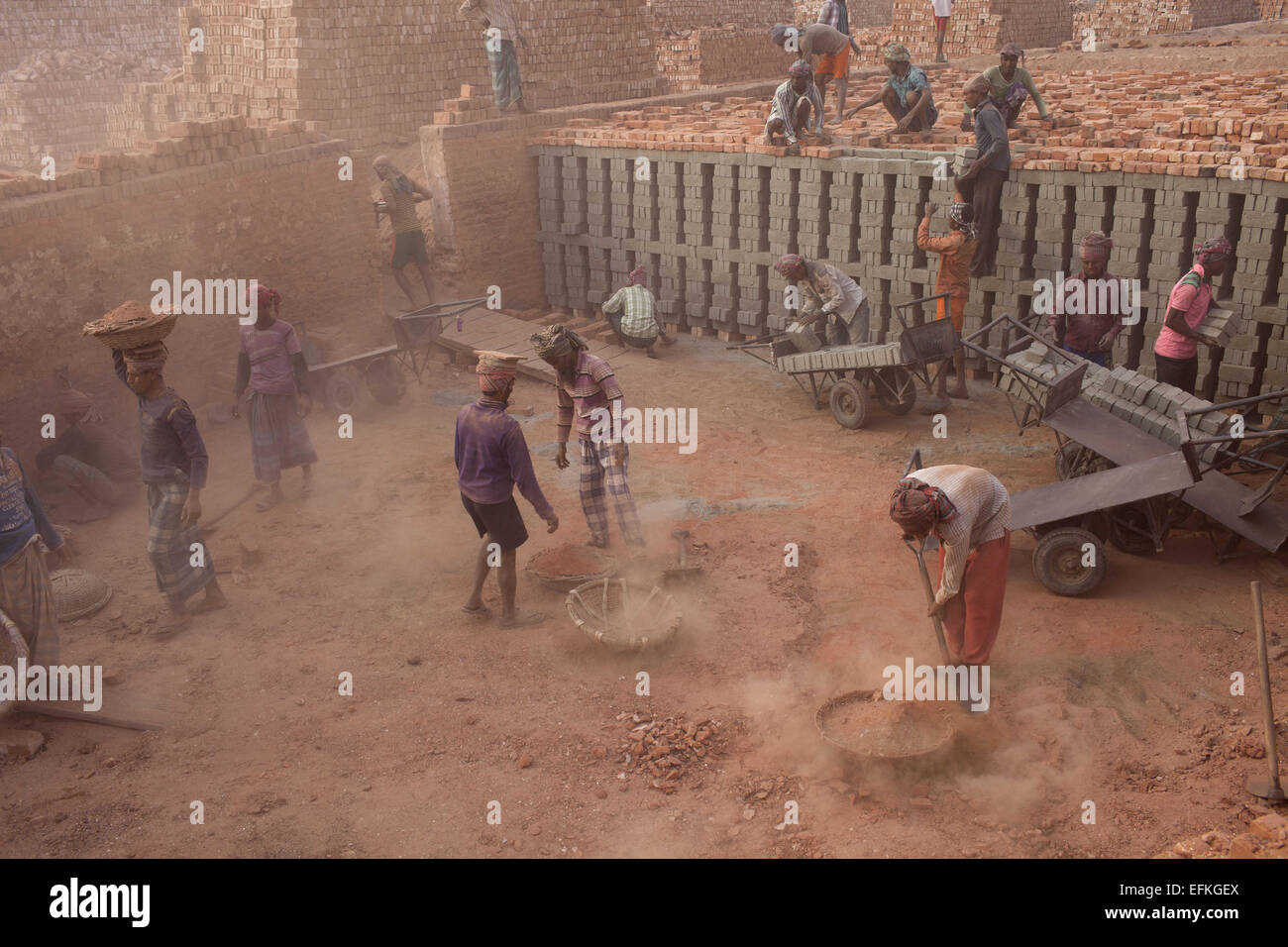 Bangladeshi day labourers work in a brick factory in Dhaka on 6 Feb ...