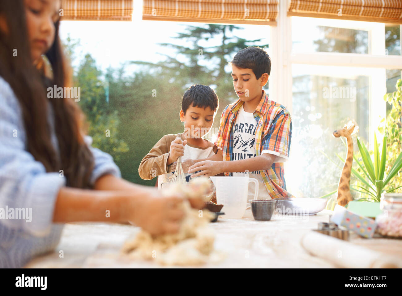 Children making dough in kitchen Stock Photo - Alamy