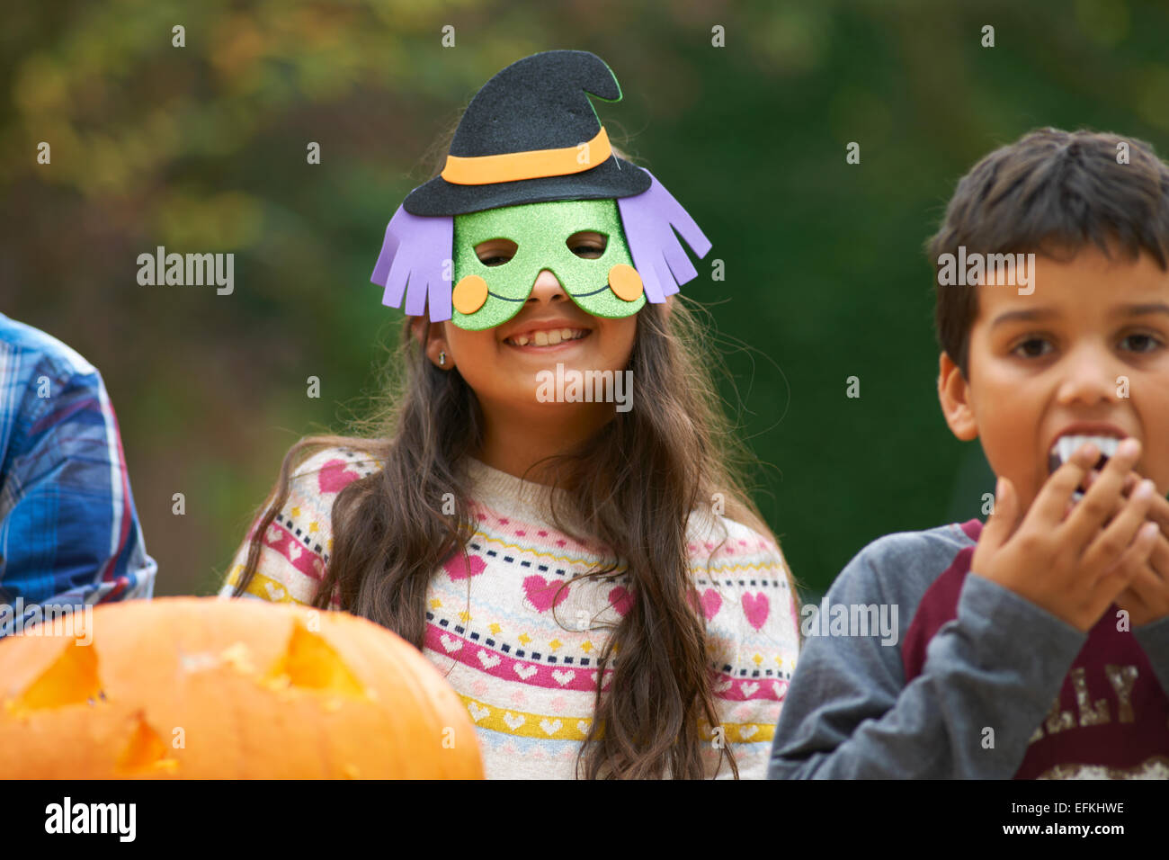 Girl wearing mask over head Stock Photo - Alamy