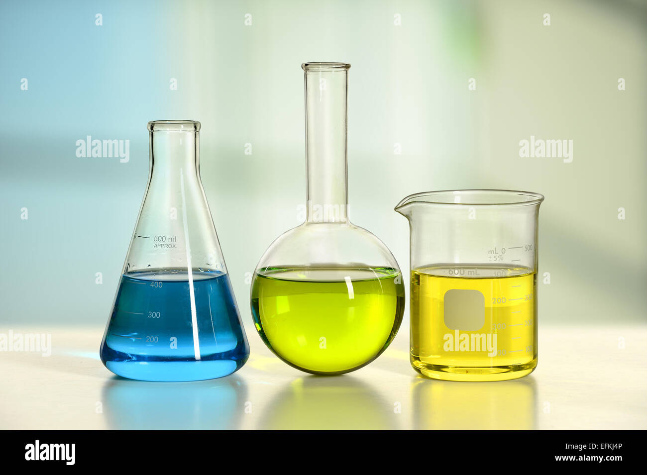 Laboratory glassware on white table with window in background Stock ...