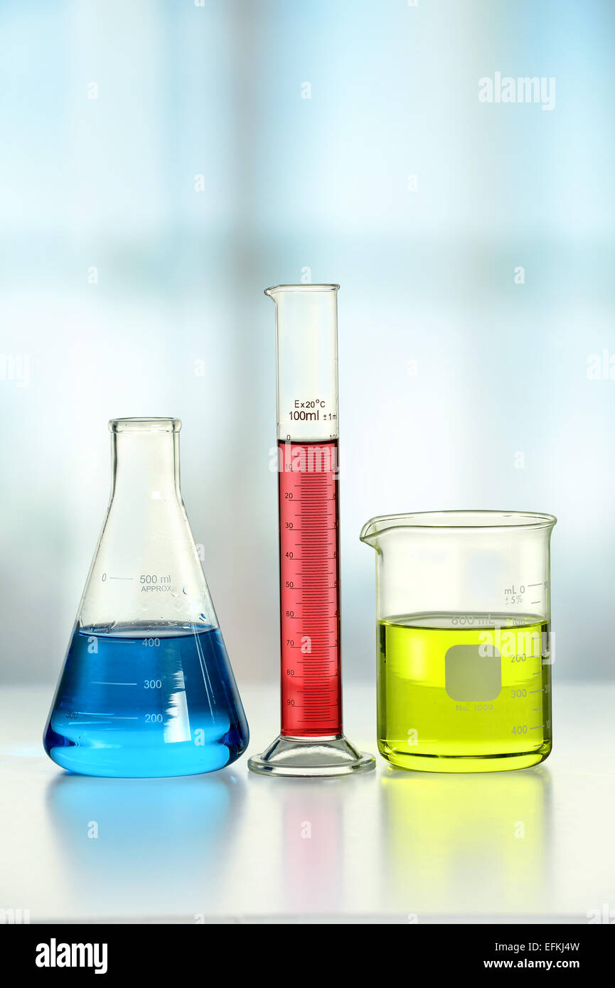 Laboratory glassware on white table and window in background Stock ...