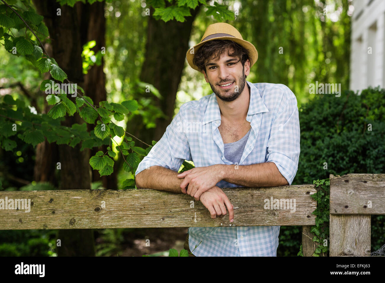 Man Leaning Against Wooden Fence High Resolution Stock Photography and ...