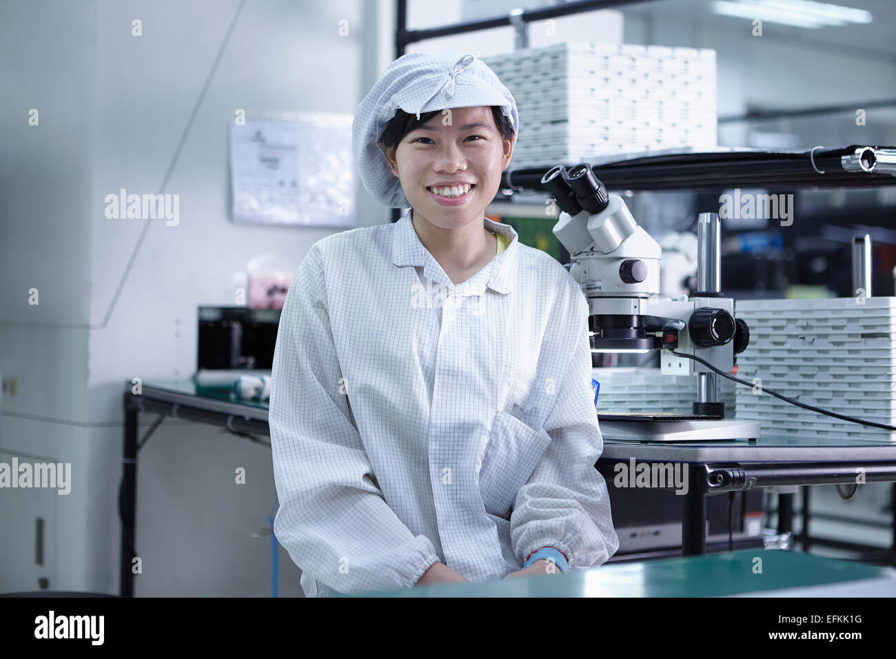 Asian lab technician on microscope hi-res stock photography and images ...